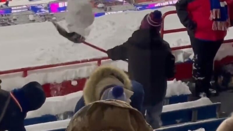 Bills Fans Dig Their Seats Out From The Snow In The Stands