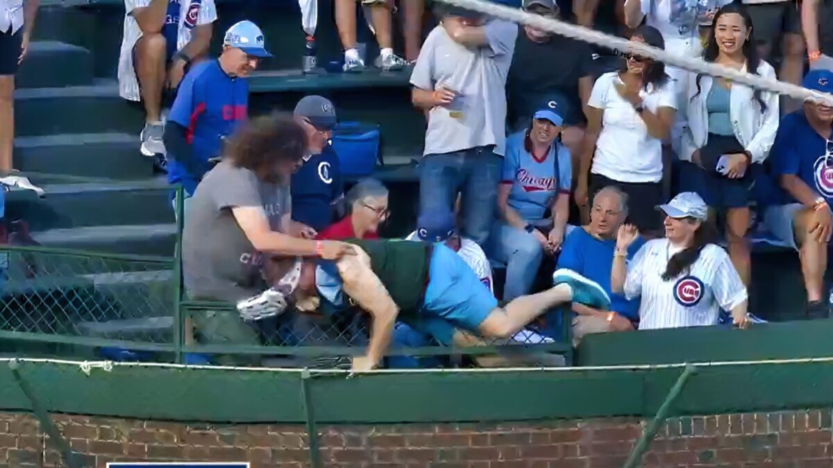 VIDEO: Chicago Cubs Fan Falls Over The Wall While Trying To Catch A ...