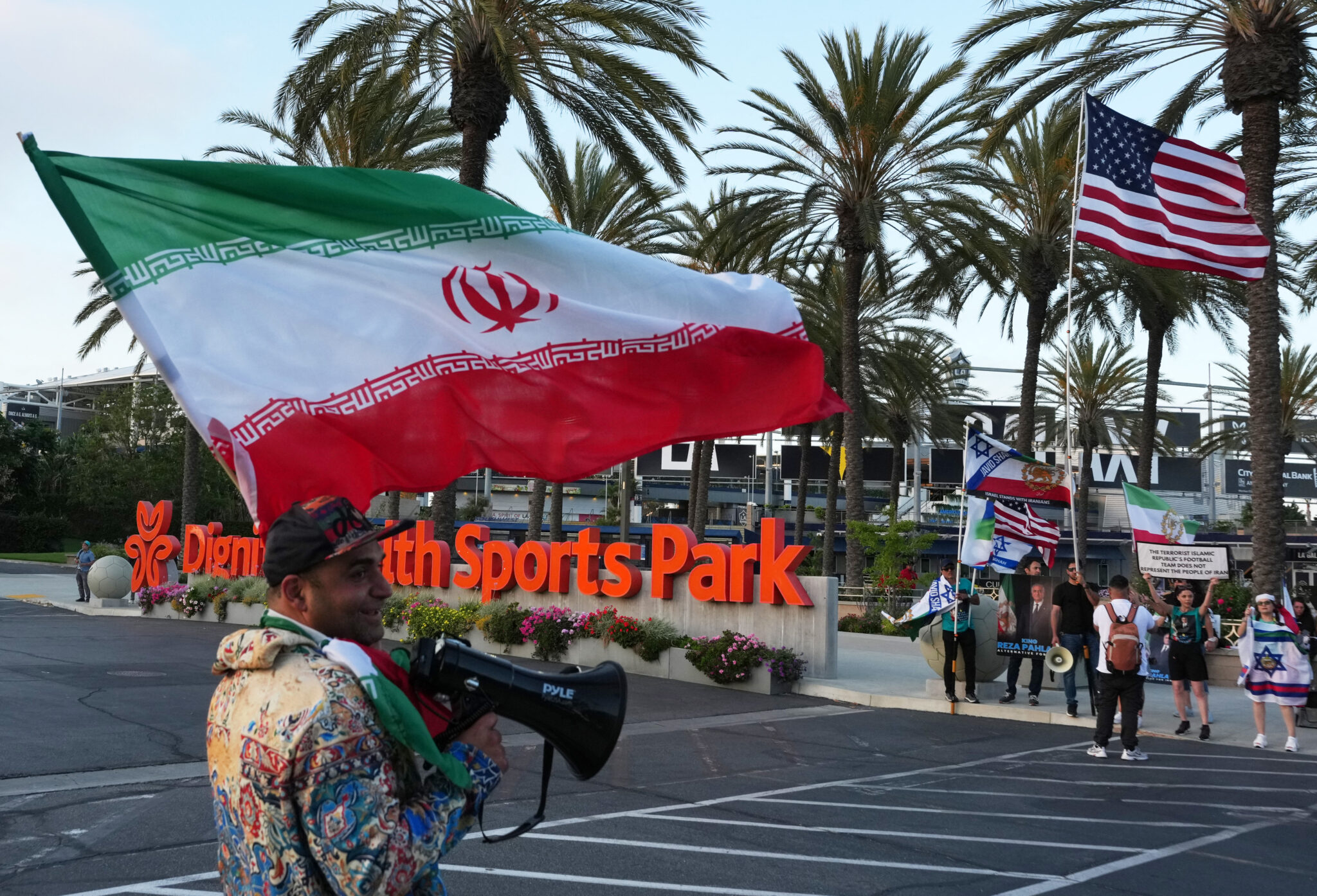 Iranian Fan Defies FIFA Ban with Lion and Sun Flag at World Cup